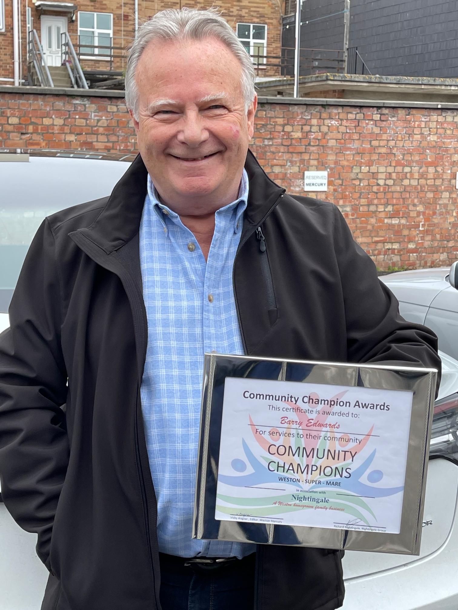 Barry receiving his Community Champions Award from Richard Nightingale ...